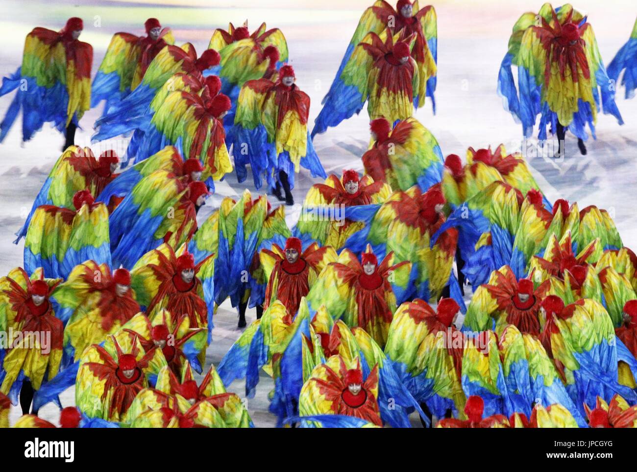Dancers wearing colorful costumes perform during the closing ceremony ...