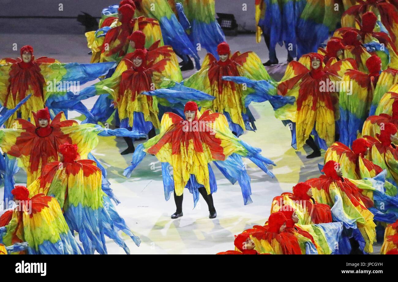 Dancers wearing colorful costumes perform during the closing ceremony ...