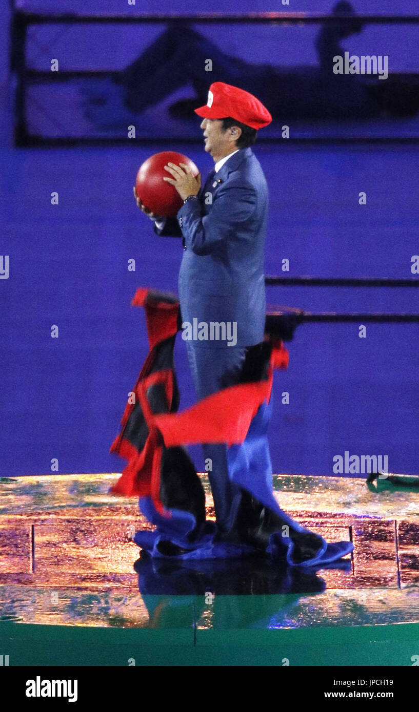 Japanese Prime Minister Shinzo Abe, dressed up as Super Mario, makes an ...