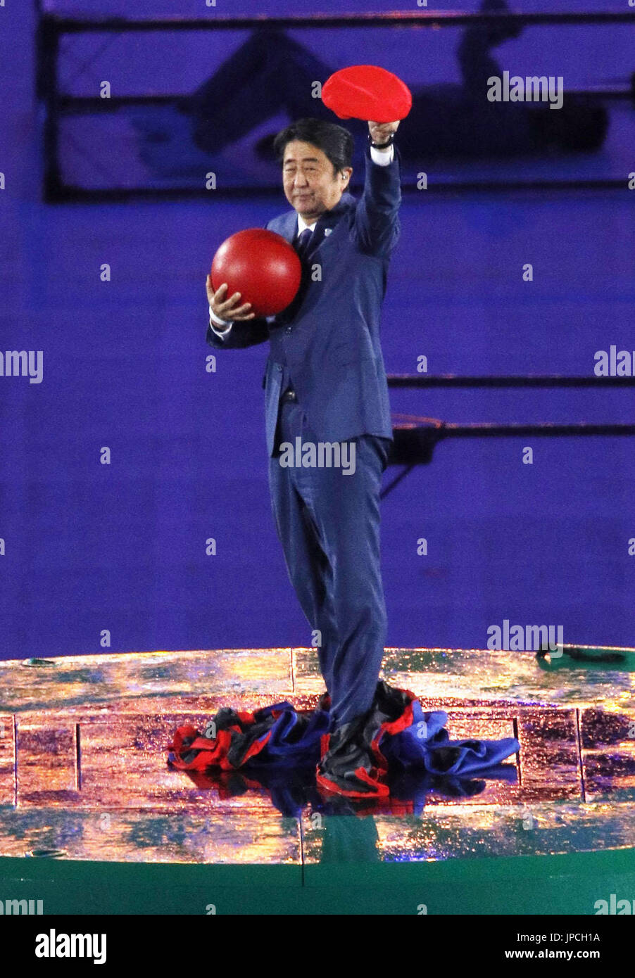 Japanese Prime Minister Shinzo Abe, dressed up as Super Mario, makes an ...