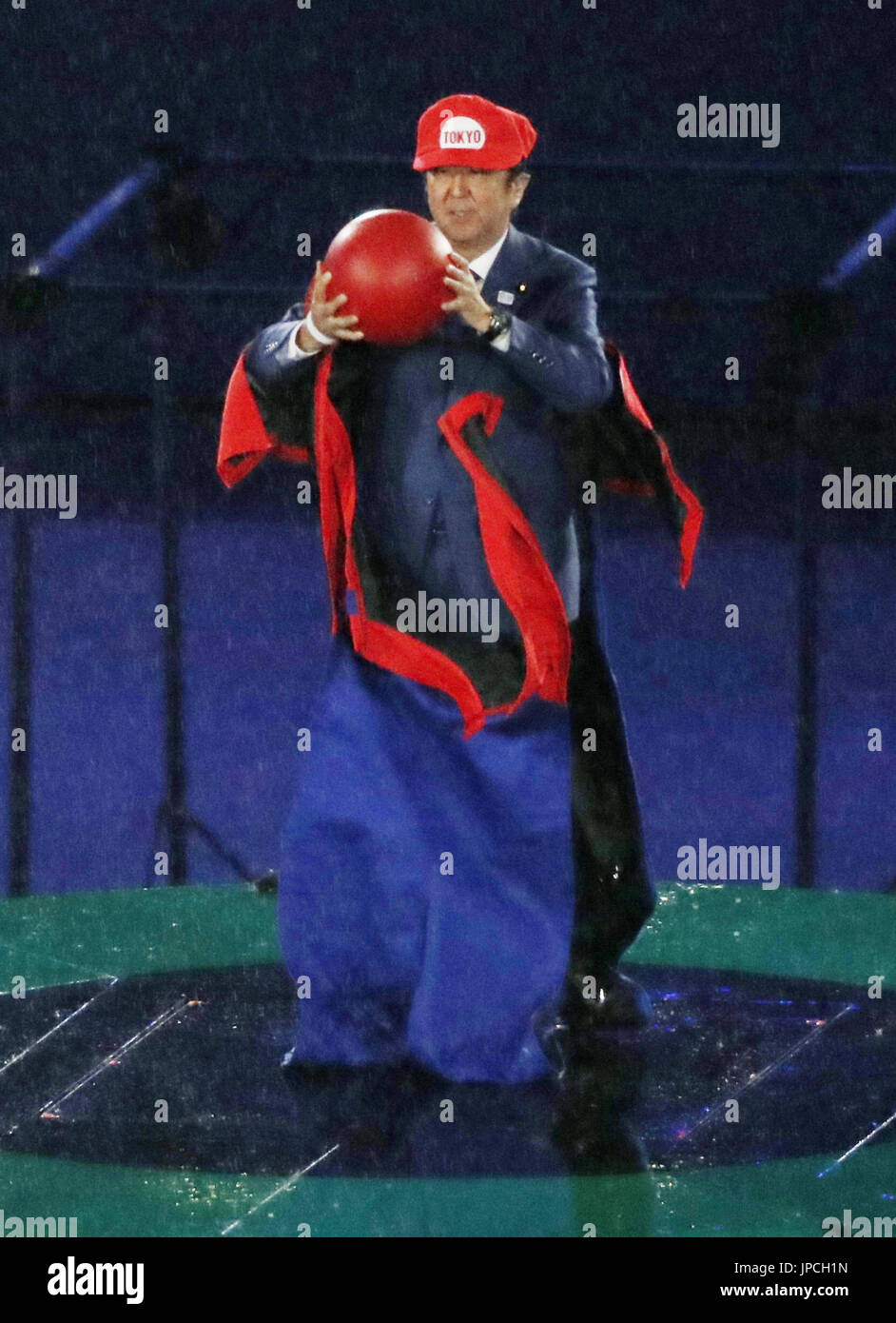 Japanese Prime Minister Shinzo Abe, dressed up as Super Mario, makes an ...