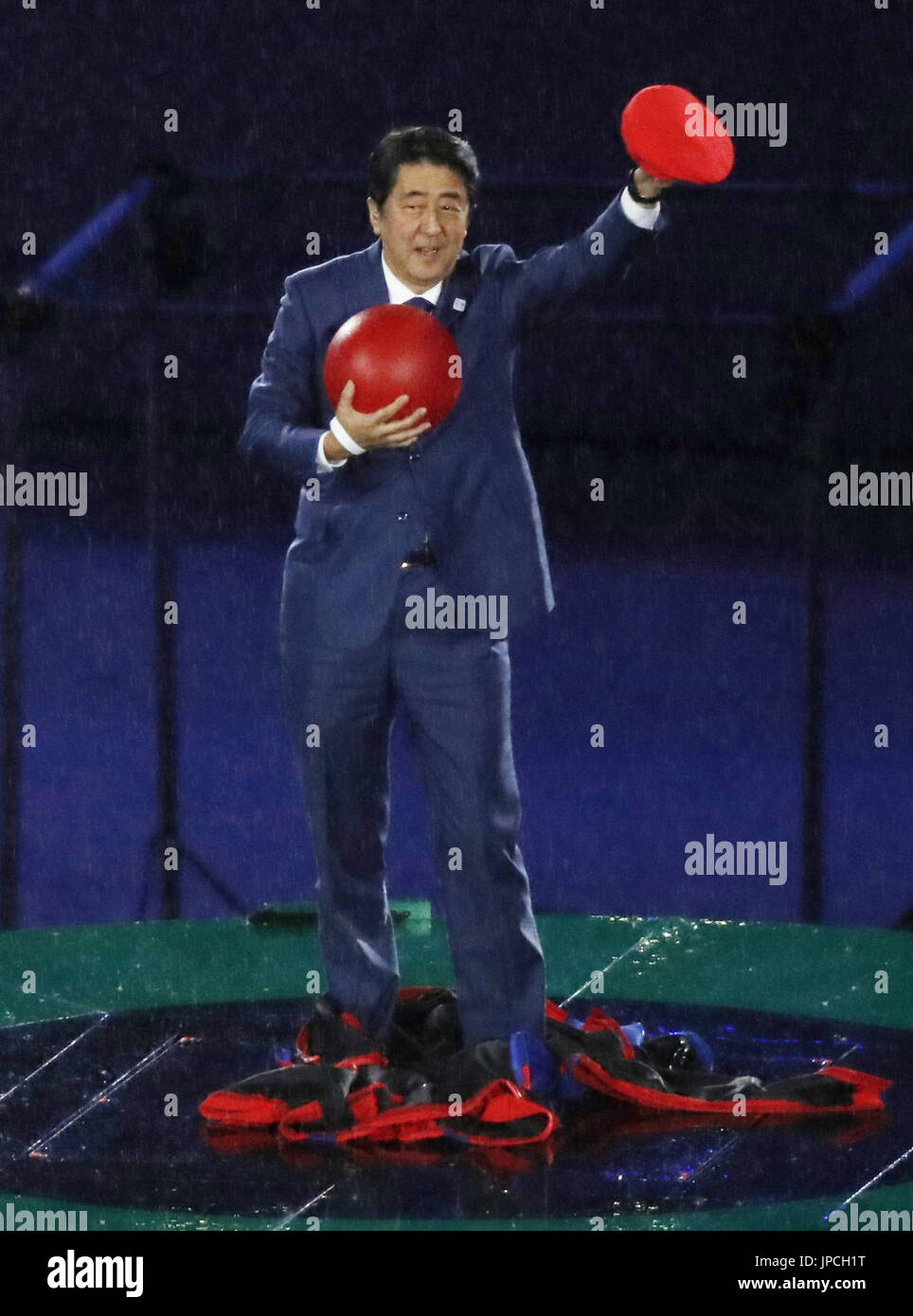 Japanese Prime Minister Shinzo Abe, dressed up as Super Mario, makes an ...