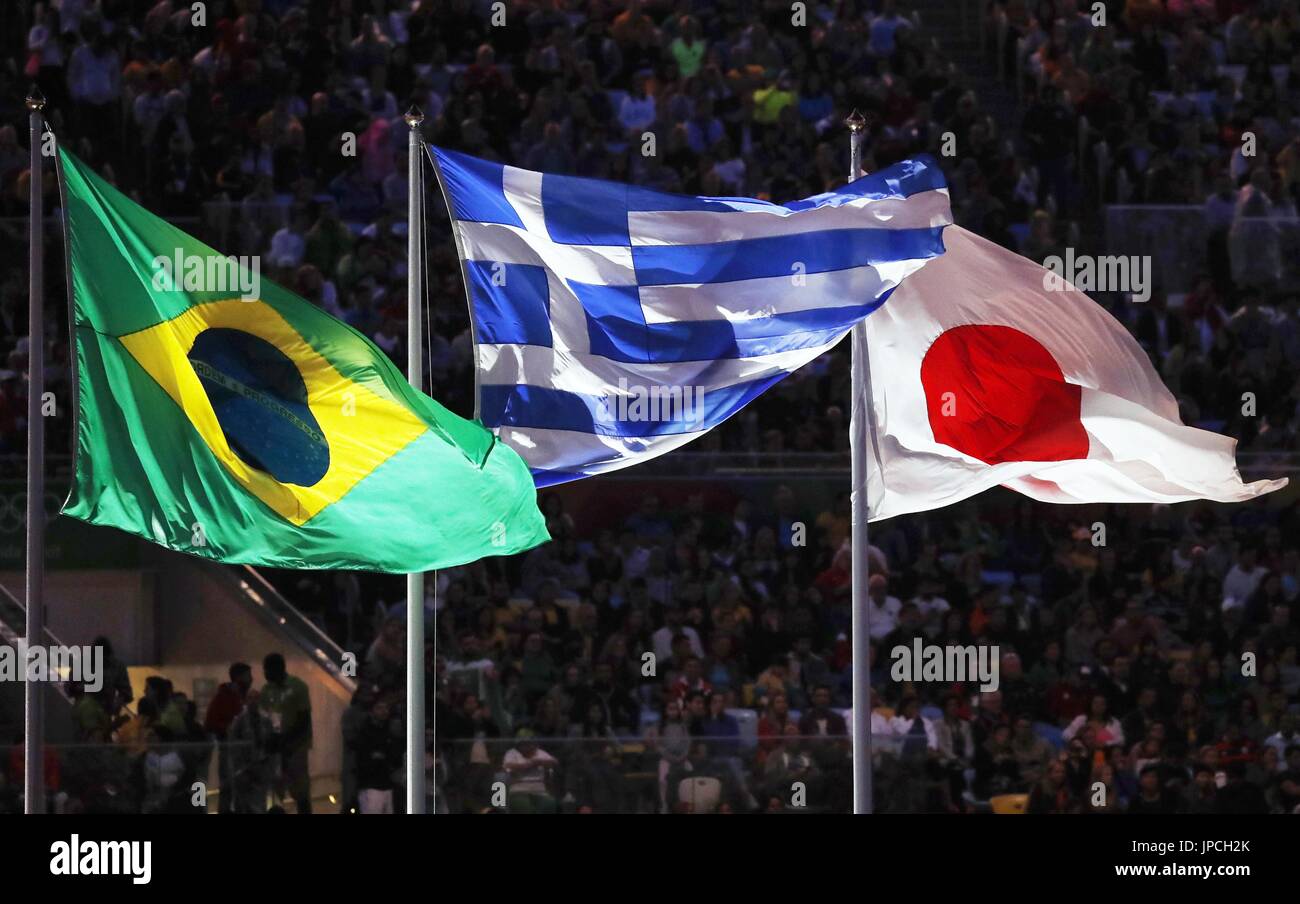 The national flags of Brazil, Greece and Japan are raised during the ...