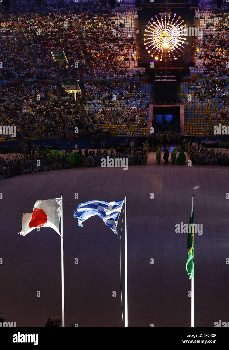 The national flags of (from L) Japan, Greece and Brazil are raised ...