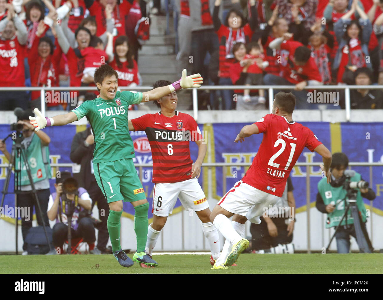 Urawa Reds players celebrate securing their first major title in 10 ...