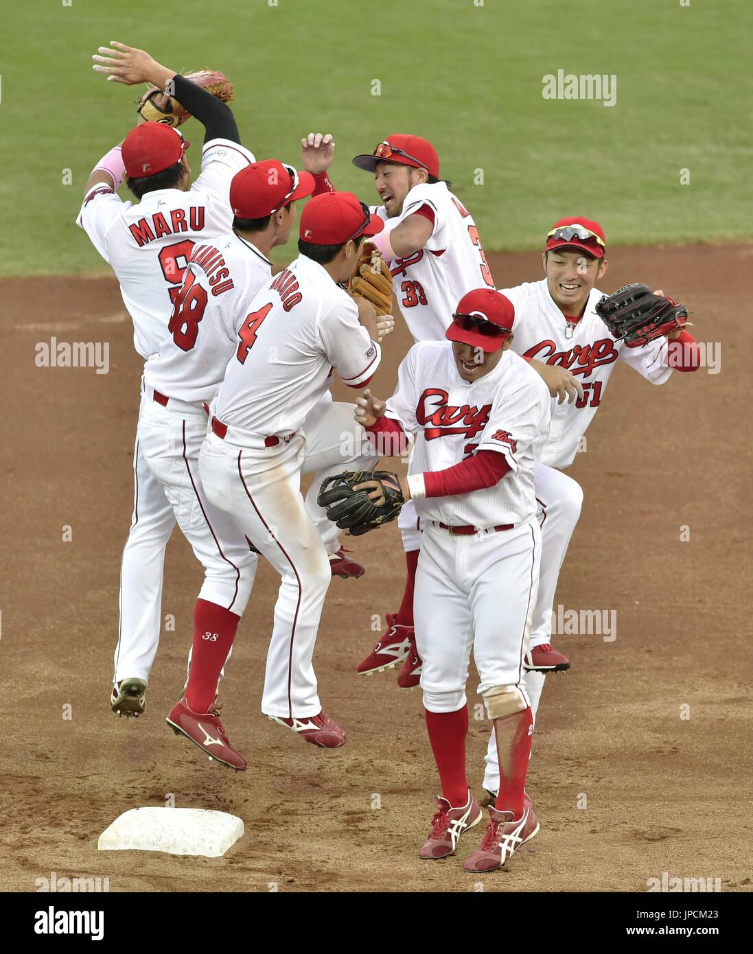 Hiroshima Carp players celebrate after beating the DeNA BayStars 8-7 on Oct. 15, 2016, in the ...