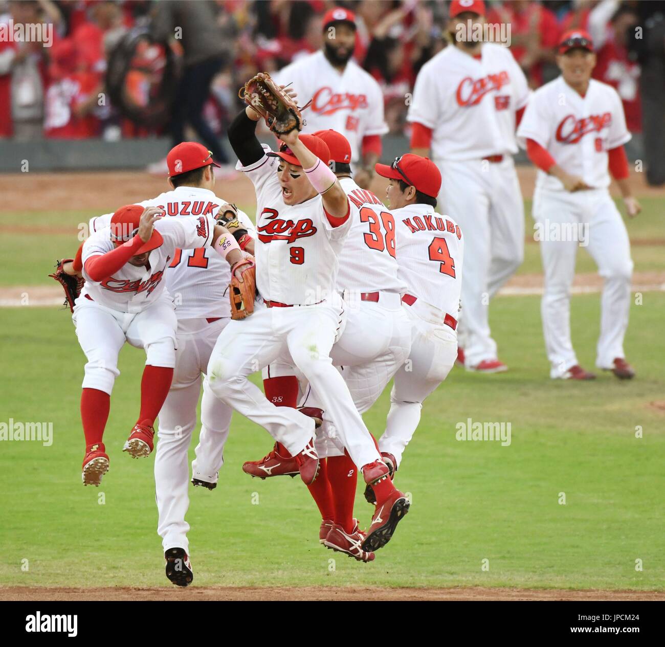 Hiroshima Carp players celebrate after beating the DeNA BayStars 8-7 on Oct. 15, 2016, in the ...