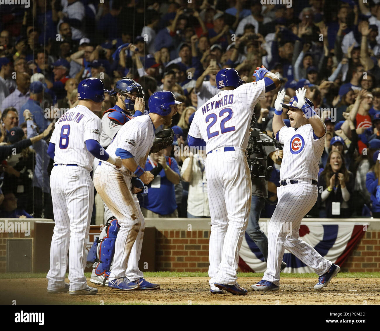 Chicago Cubs pinch-hitter Miguel Montero (R) is congratulated by his ...