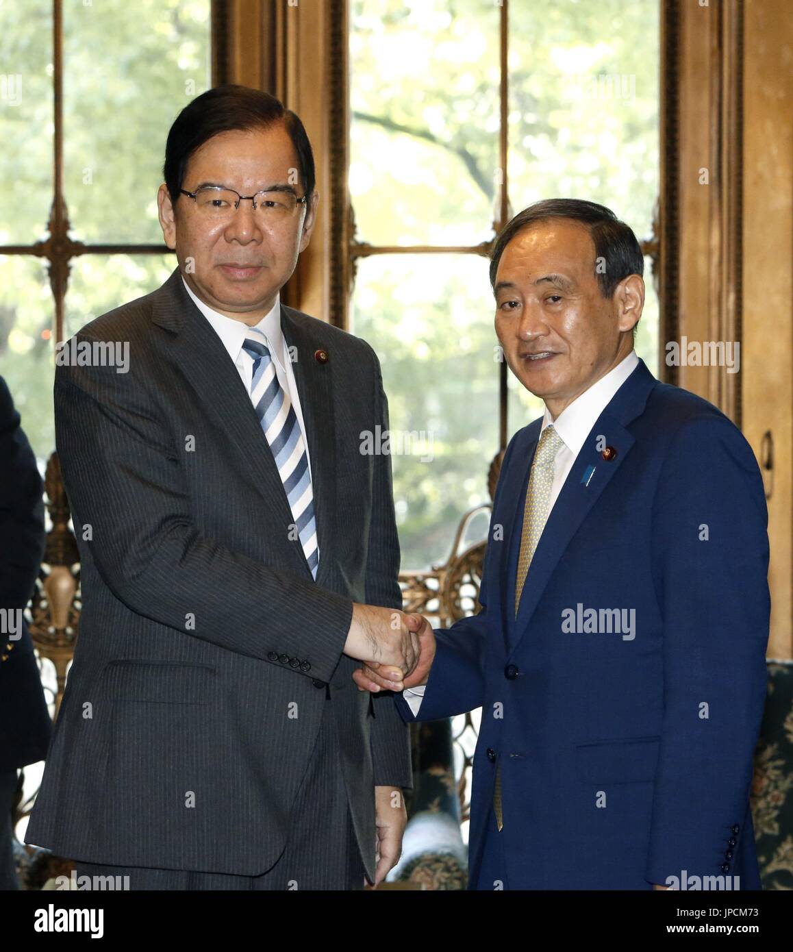 Japanese Communist Party leader Kazuo Shii (L) meets with Chief Cabinet ...