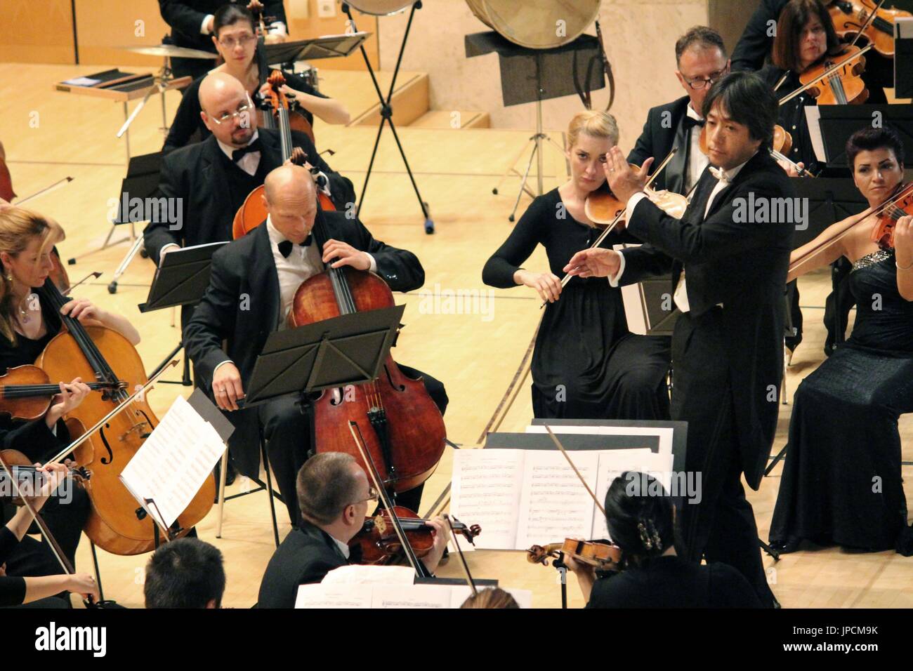 Japanese conductor Toshio Yanagisawa directs the multiethnic Balkan ...