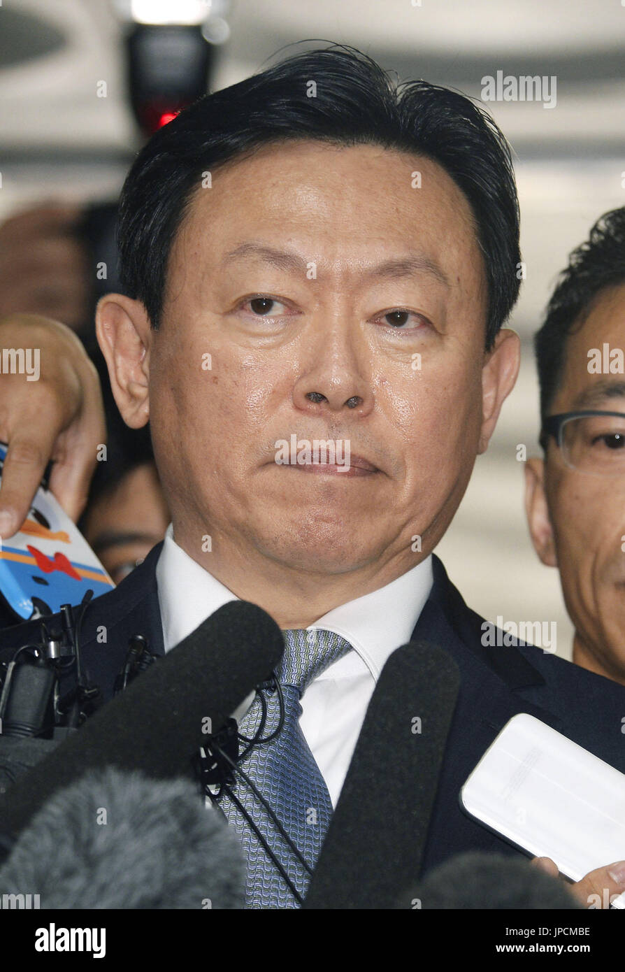 Lotte Group Chairman Shin Dong Bin is surrounded by reporters in this ...