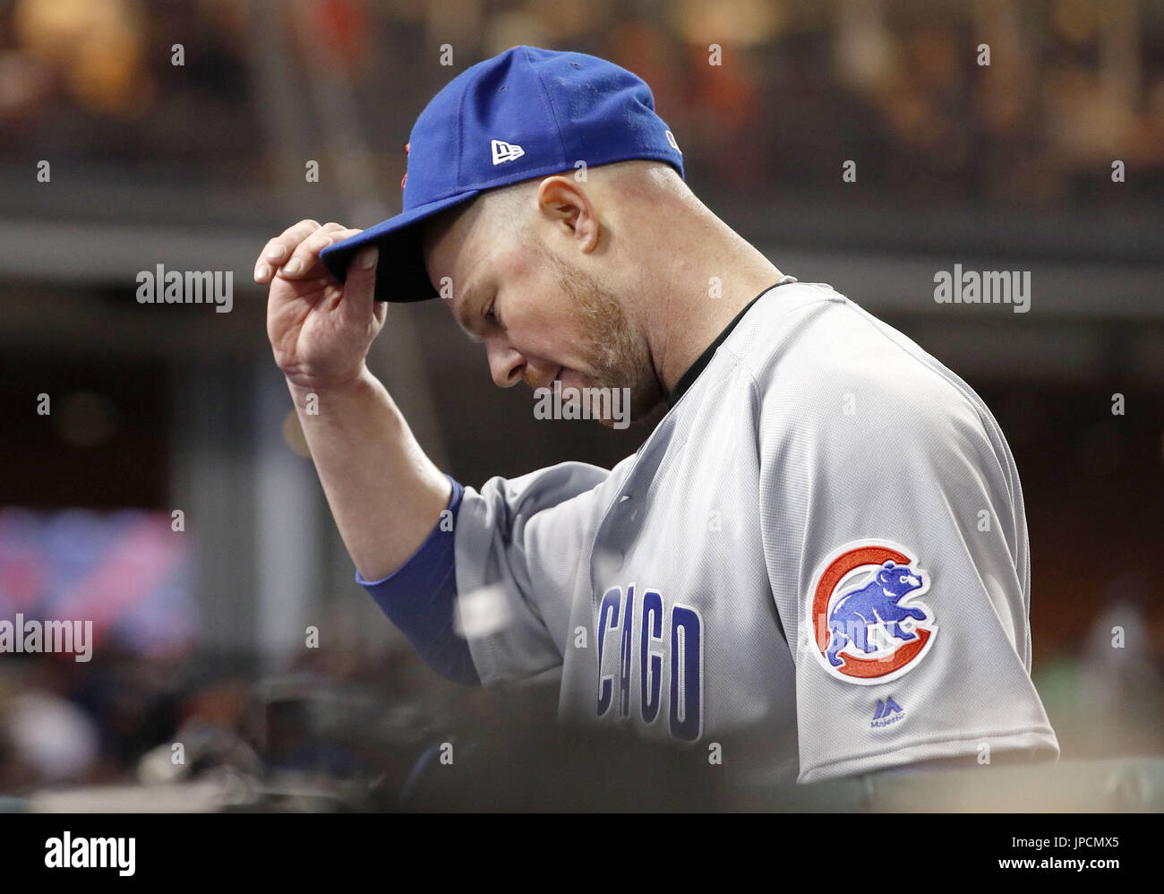Chicago Cubs starter Jon Lester returns to the bench after allowing two ...