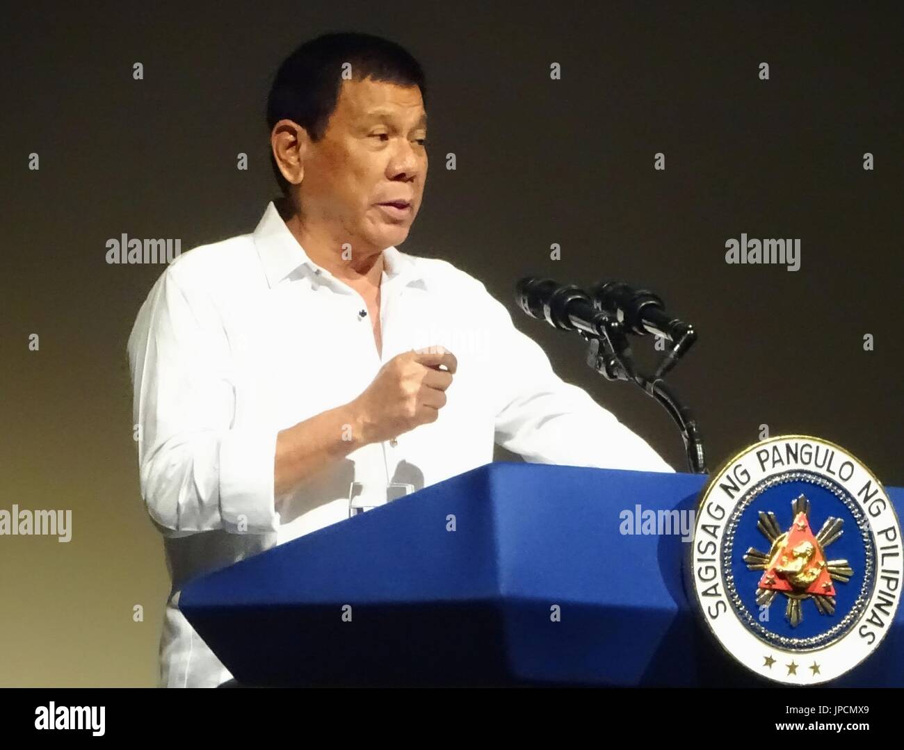 Philippine President Rodrigo Duterte delivers a speech at a forum ...