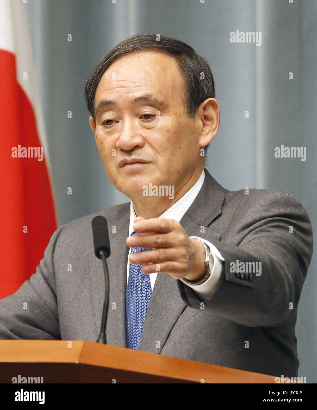 Chief Cabinet Secretary Yoshihide Suga announces at a press conference ...