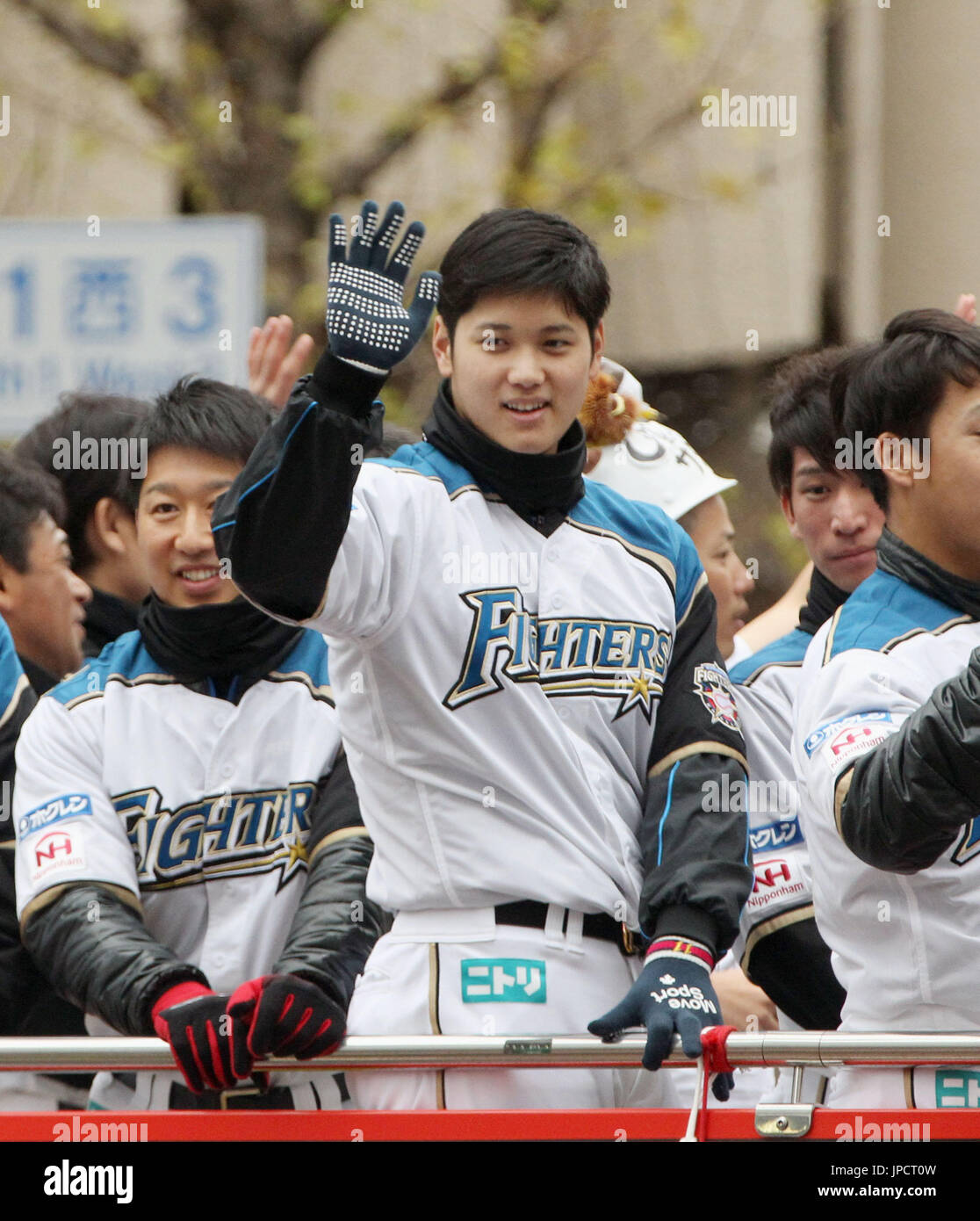 Pitcher Shohei Otani waves to fans as the Nippon Ham Fighters hold a ...