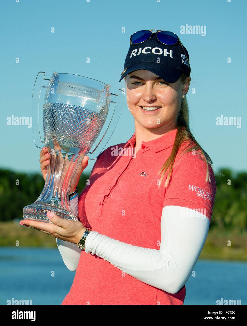 Charley Hull of England holds the winner's trophy for the LPGA season-ending CME Group Tour ...