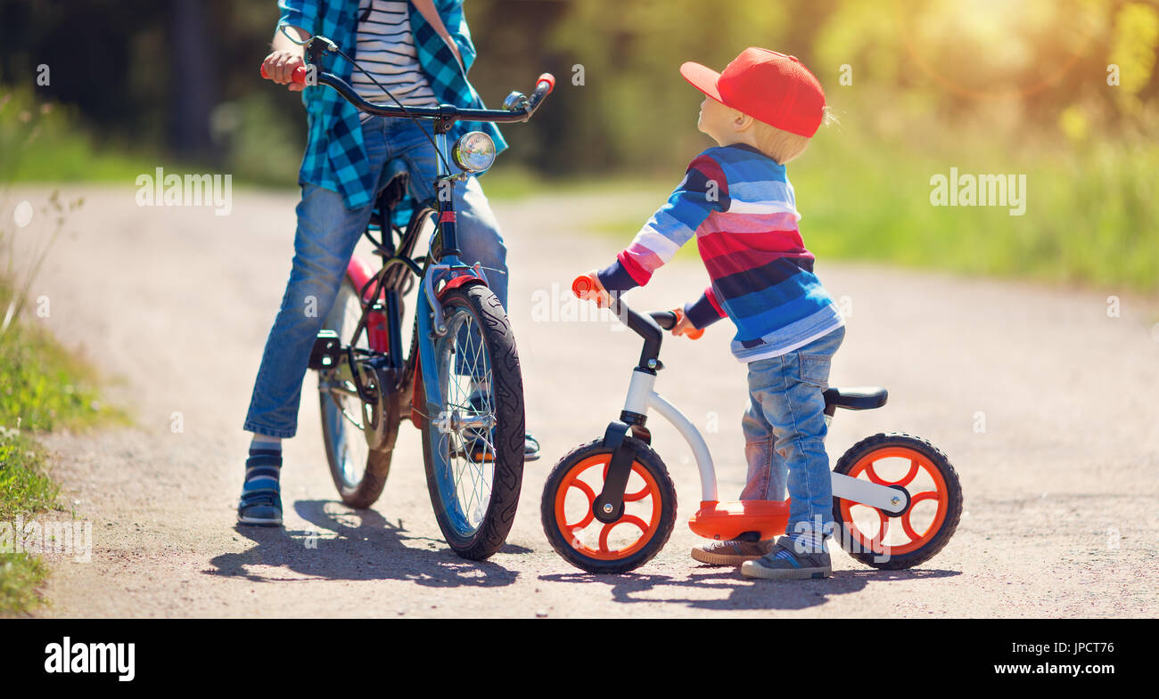Kid riding a big wheel hi-res stock photography and images - Alamy