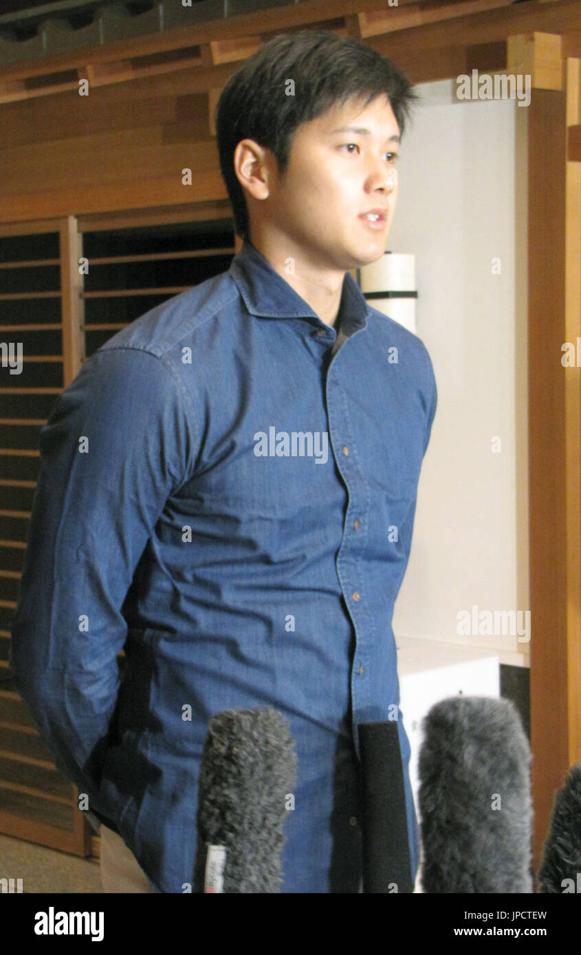 Shohei Otani of the Nippon Ham Fighters speaks to reporters in ...