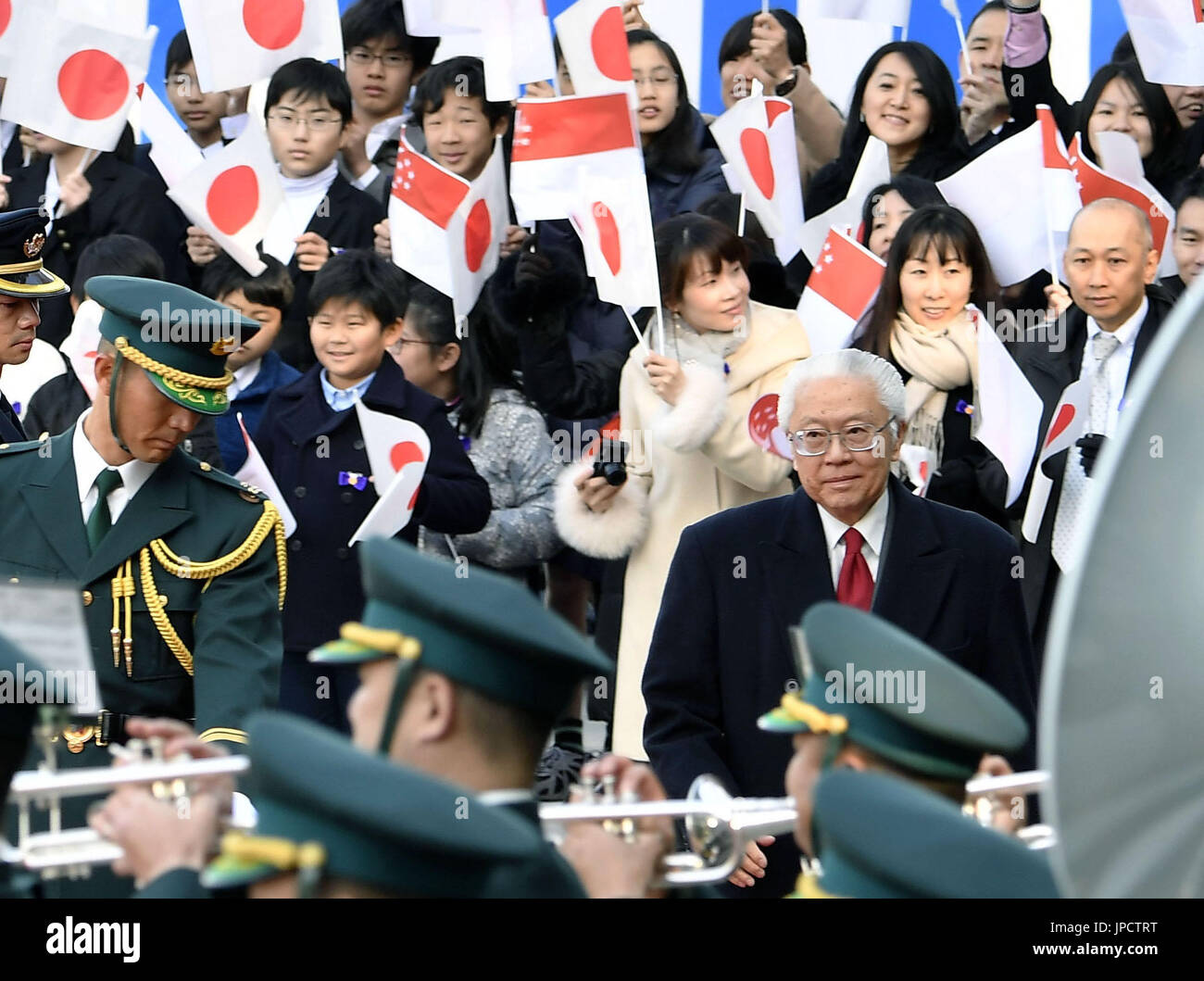 Singapore President Tony Tan (R in front) is greeted by members of the ...