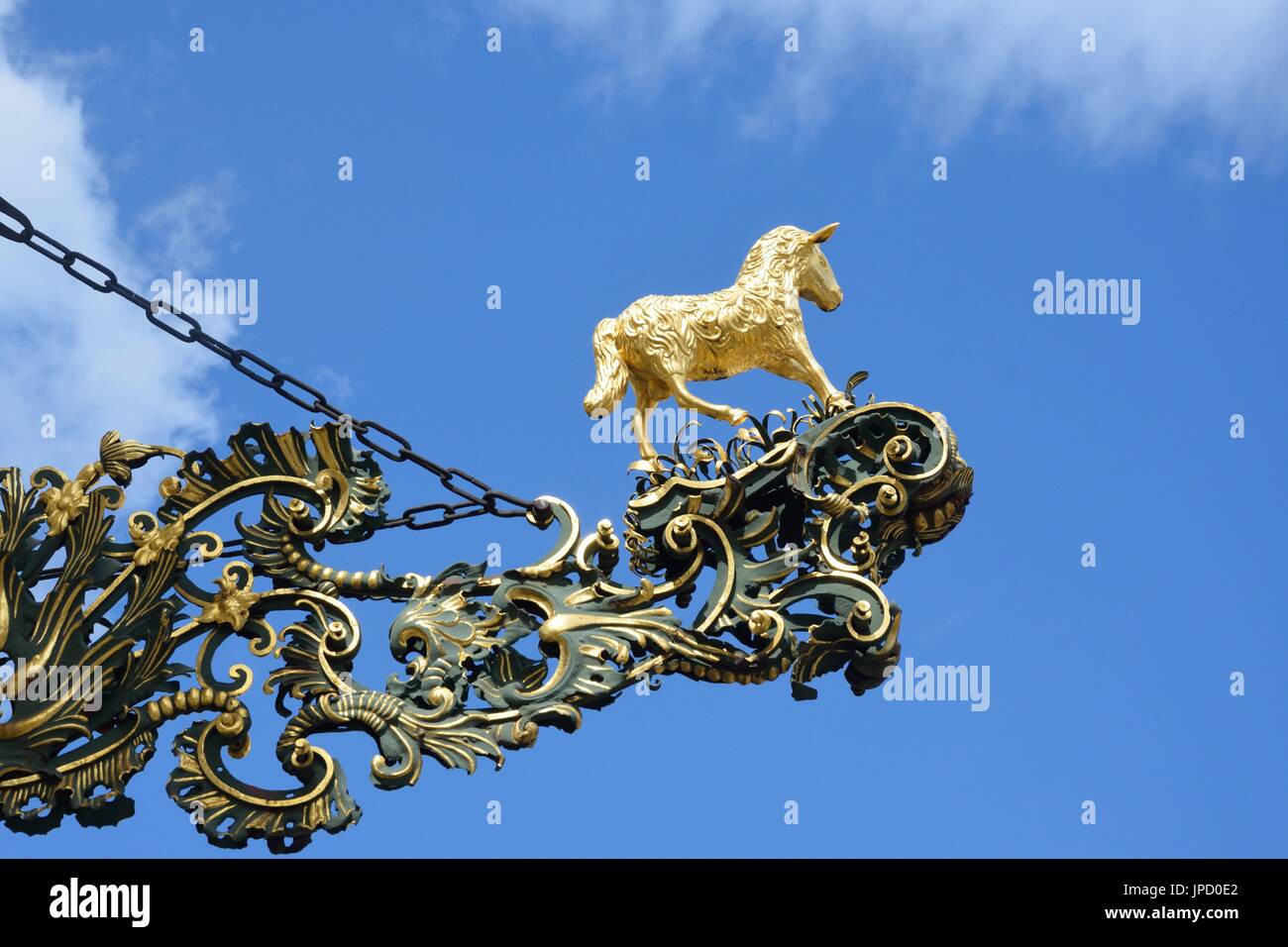 Golden lamb statue and sign Stock Photo - Alamy