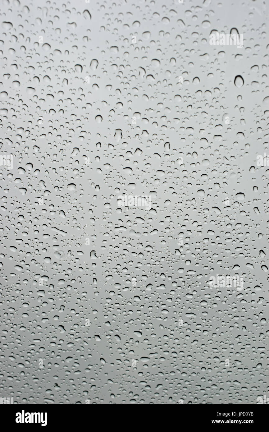 Rain drops on window glass. Abstract vertical background Stock Photo ...