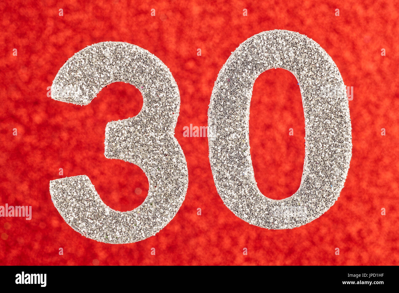Number thirty silver color over a red background. Anniversary ...