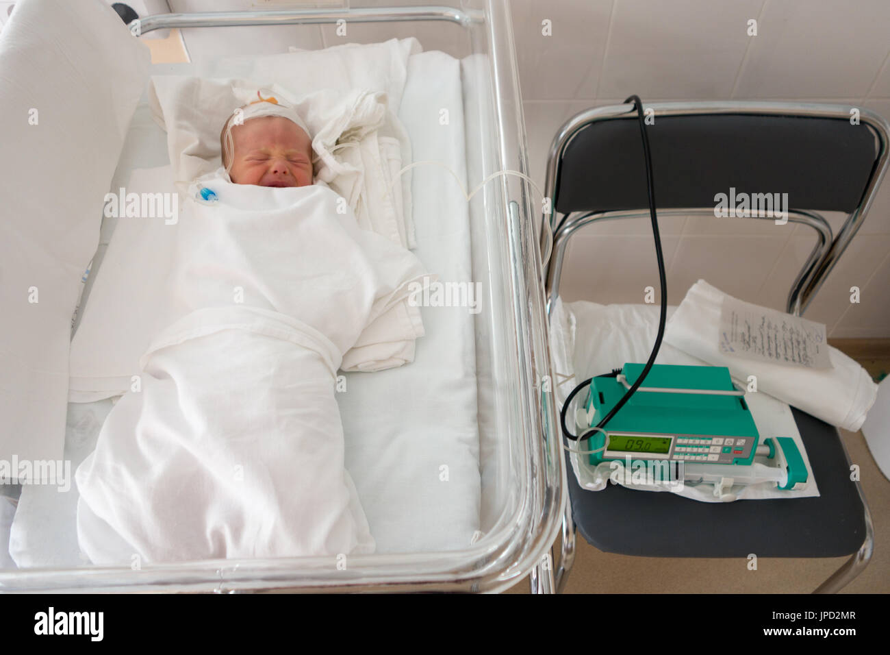 Newborn baby sleeping on a drip in a hospital Stock Photo - Alamy