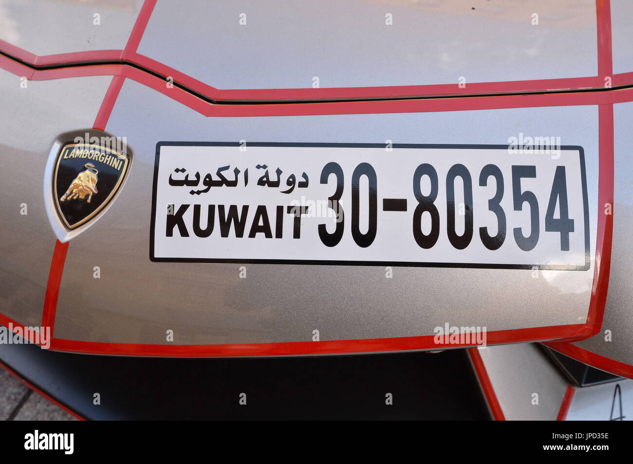 A silver Lamborghini with red stripes and a Kuwait number plate is ...