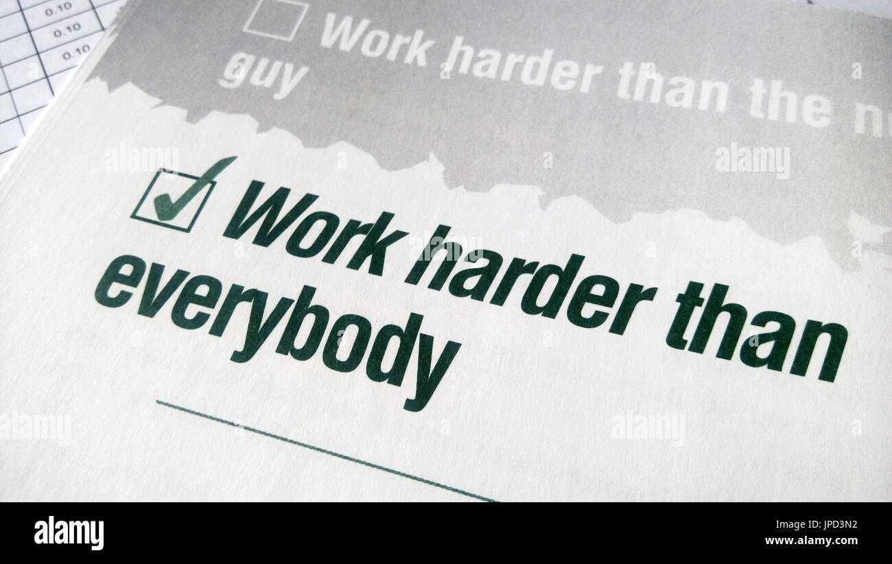 Work harder than everybody printed on a book Stock Photo - Alamy