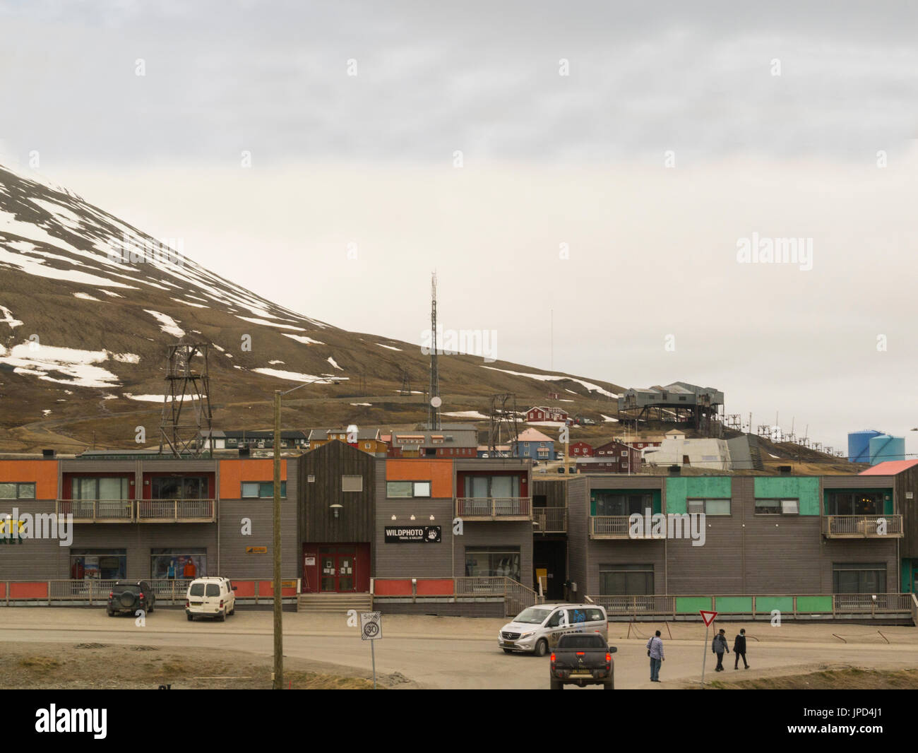 Main street with shops and sports centre Longyearbyen Svalbard on grey ...