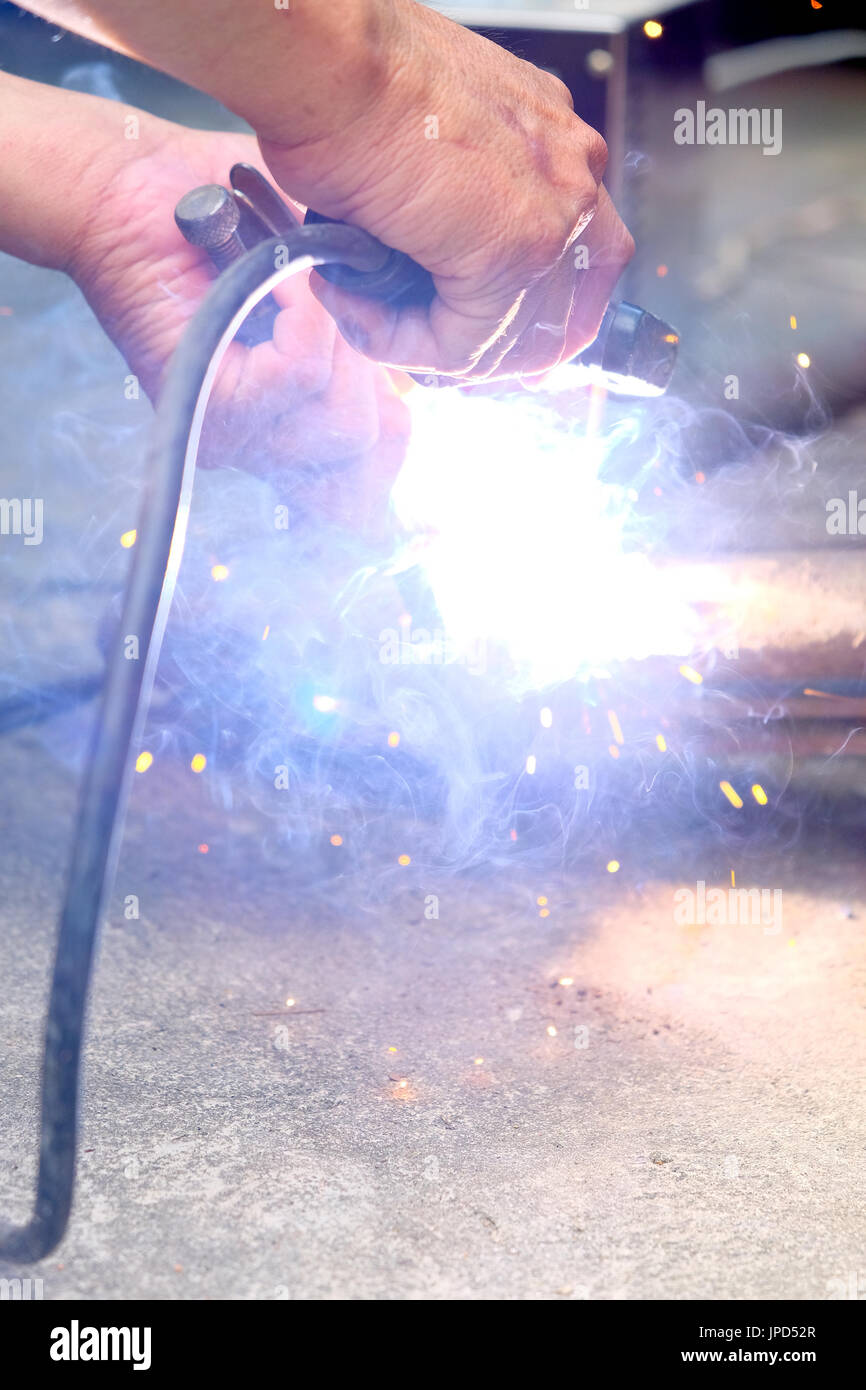 electric welding in worker hand Stock Photo - Alamy