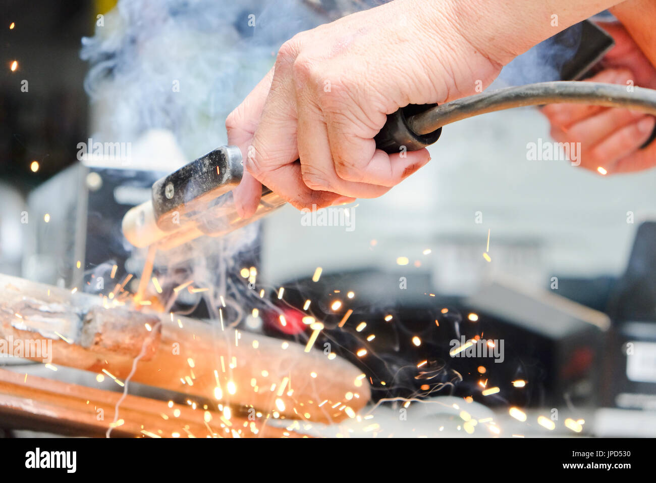 electric welding in worker hand Stock Photo - Alamy