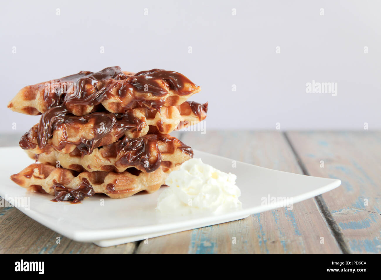 Chocolate fudge waffle with whipped cream Stock Photo - Alamy