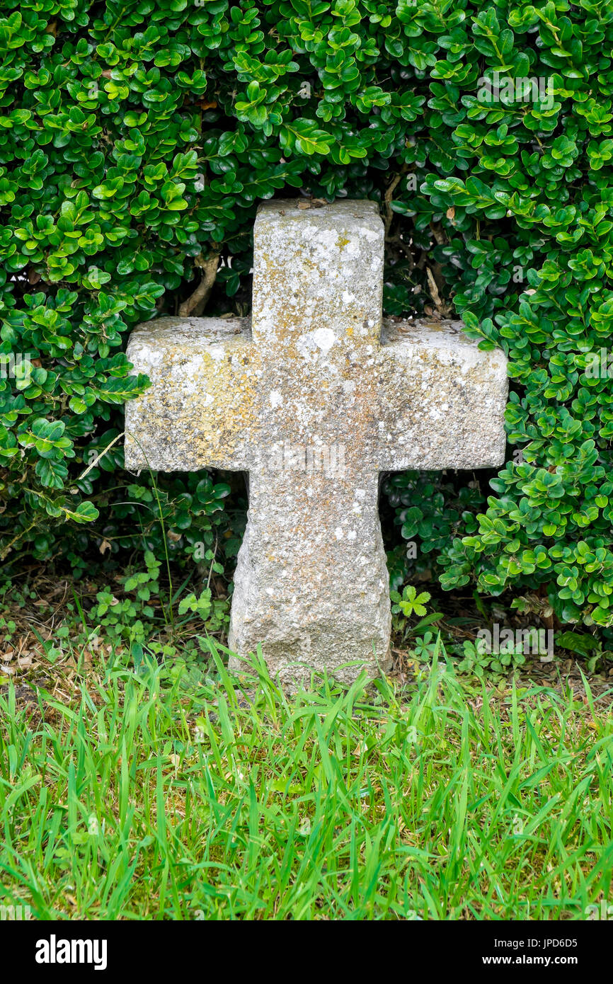 Gravestones in the cemetery garden of Saint-Blaise church, Lacommande ...