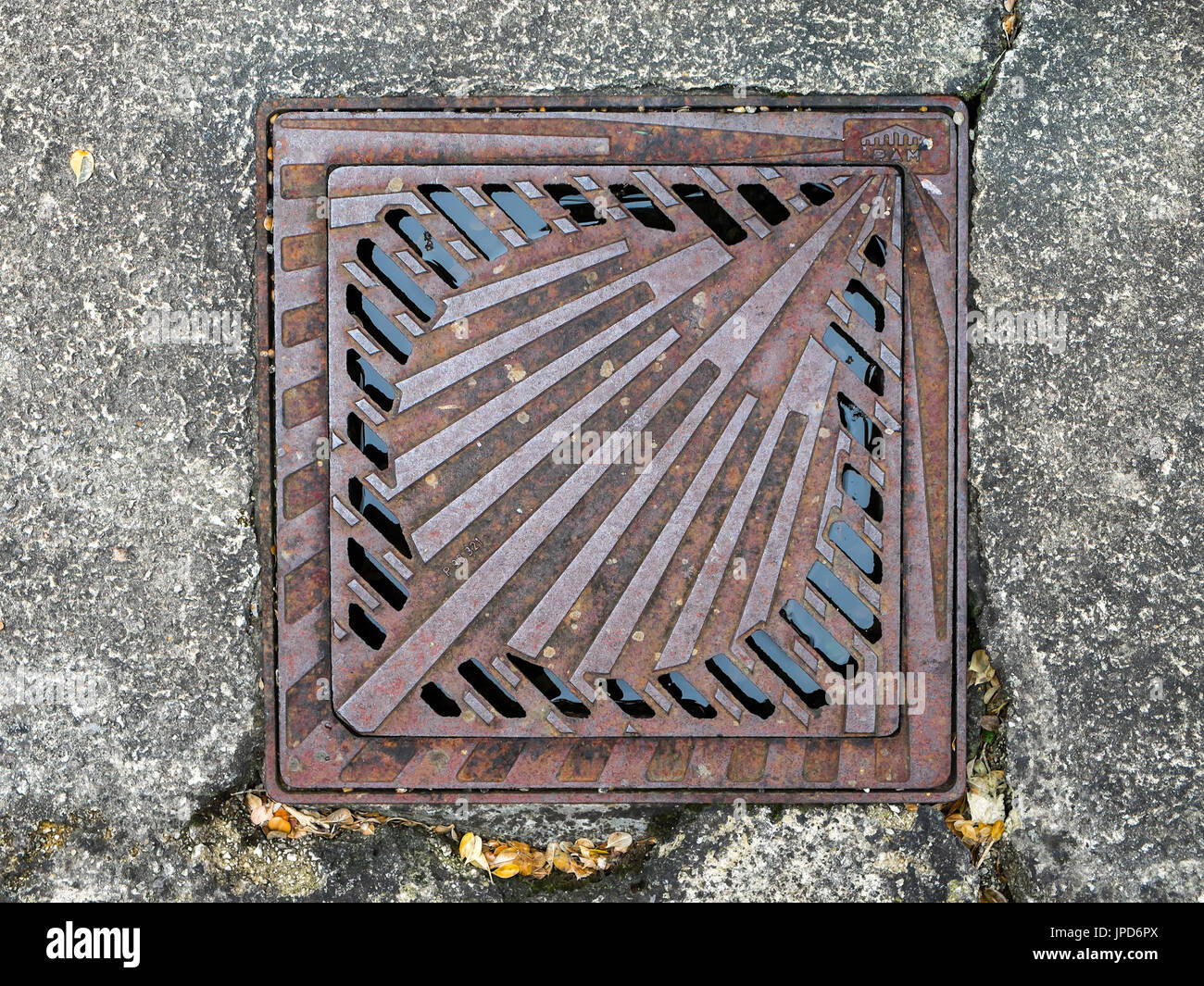 Shell symbol on drainage grids - on the Route of Santiago de Compostela ...