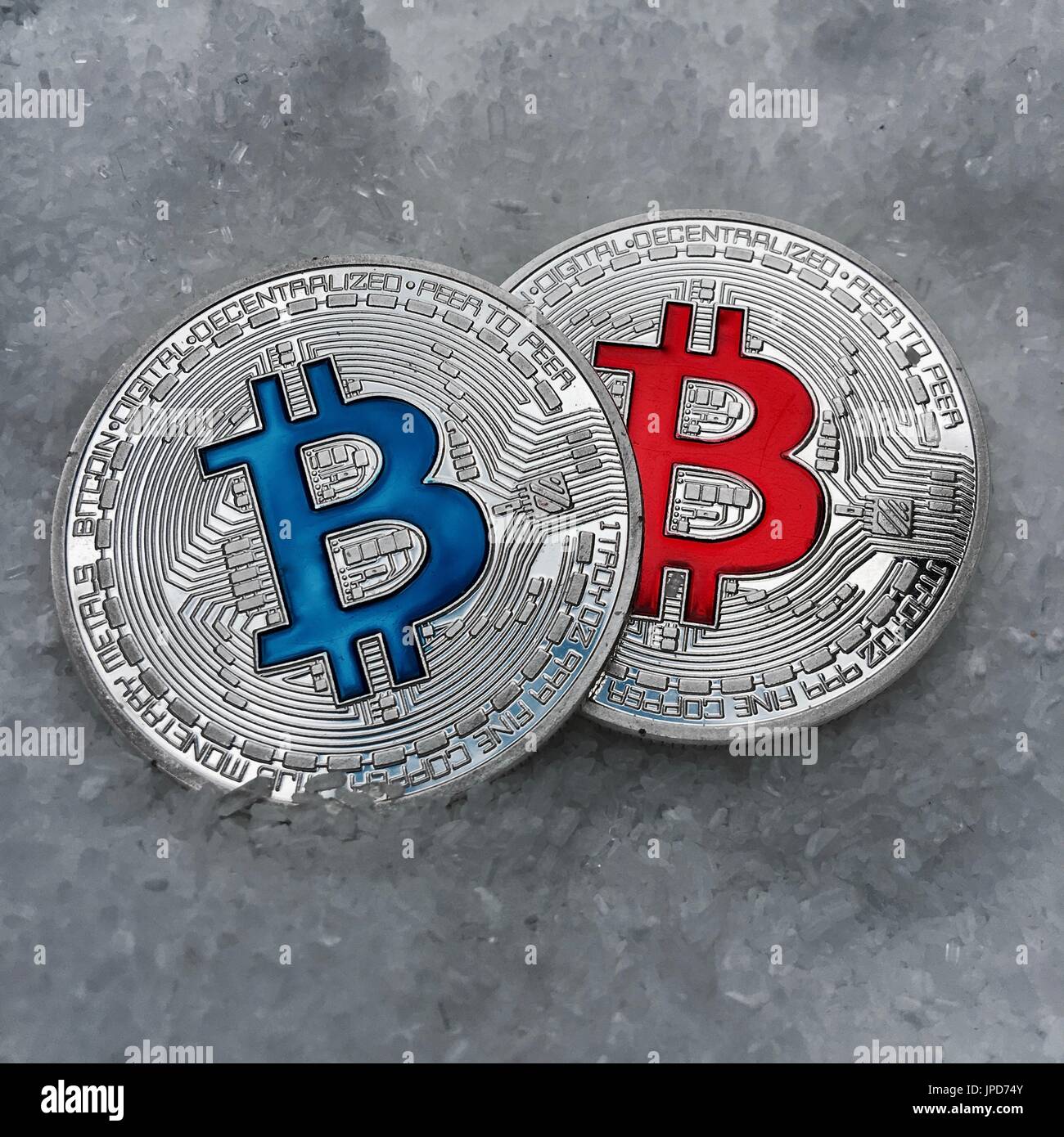 Digital currency physical metal coin on the white cristal background ...