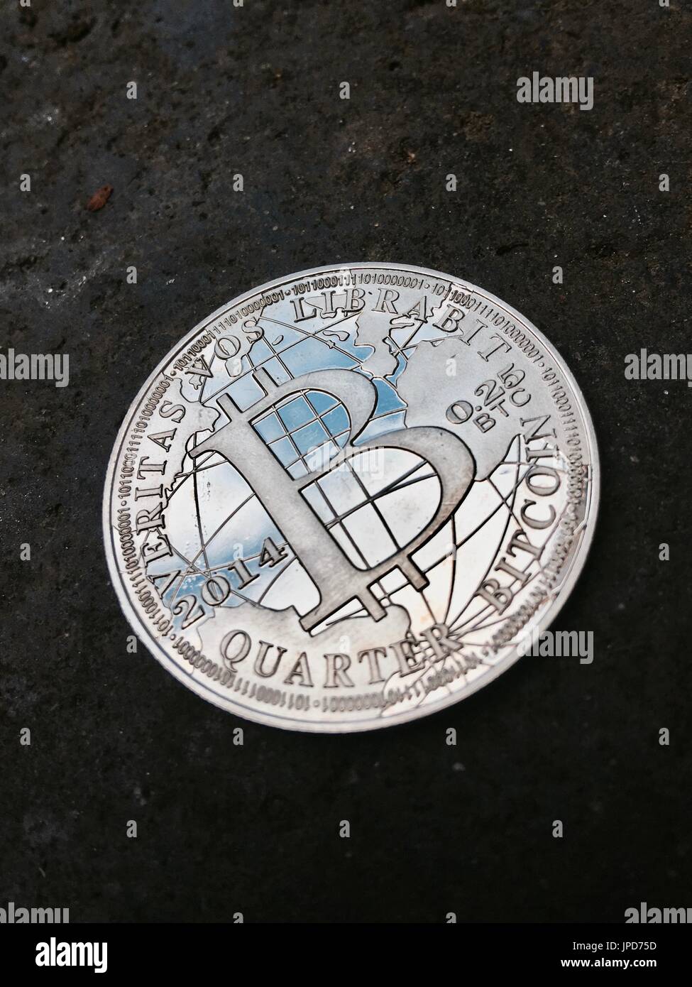 Digital currency physical metal coin on the white cristal background ...