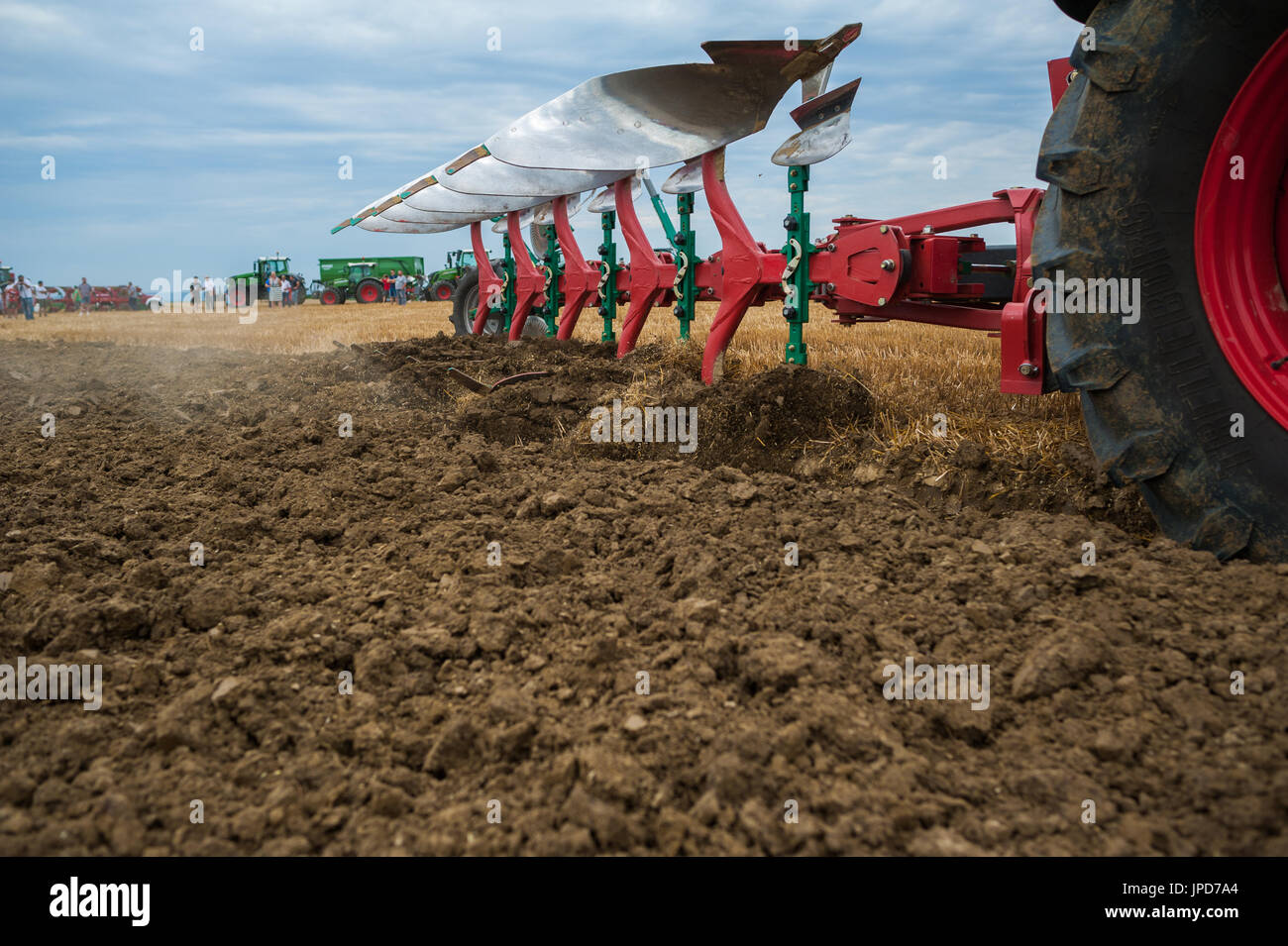 Fendt tractor plowing earth on country fair Stock Photo - Alamy