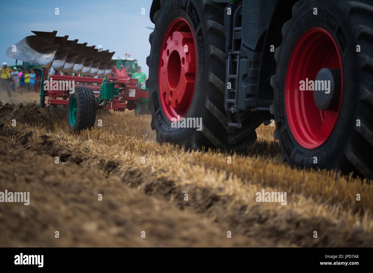 Fendt tractor plowing earth on country fair Stock Photo - Alamy