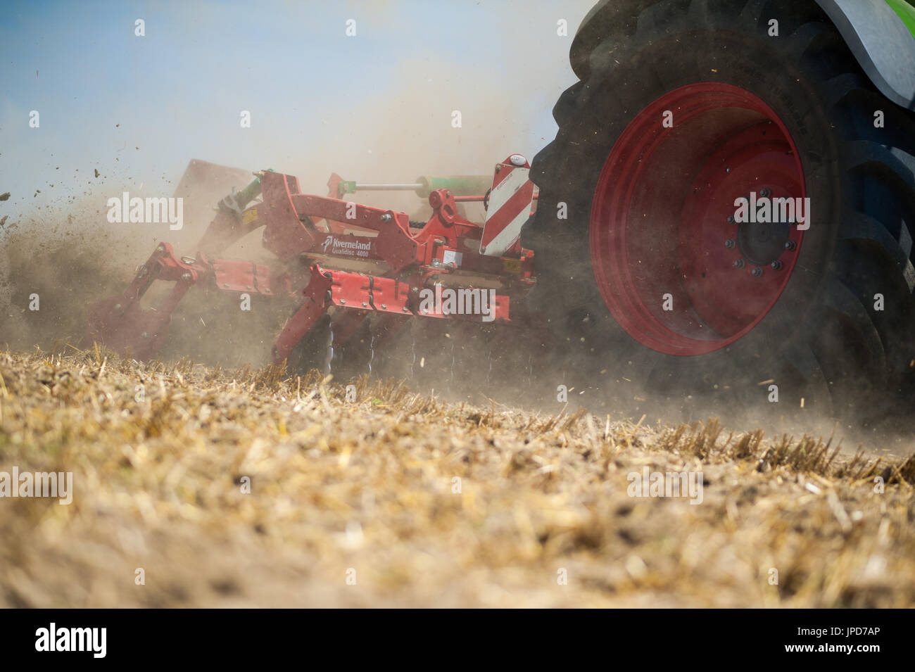 Fendt tractor plowing earth on country fair Stock Photo - Alamy