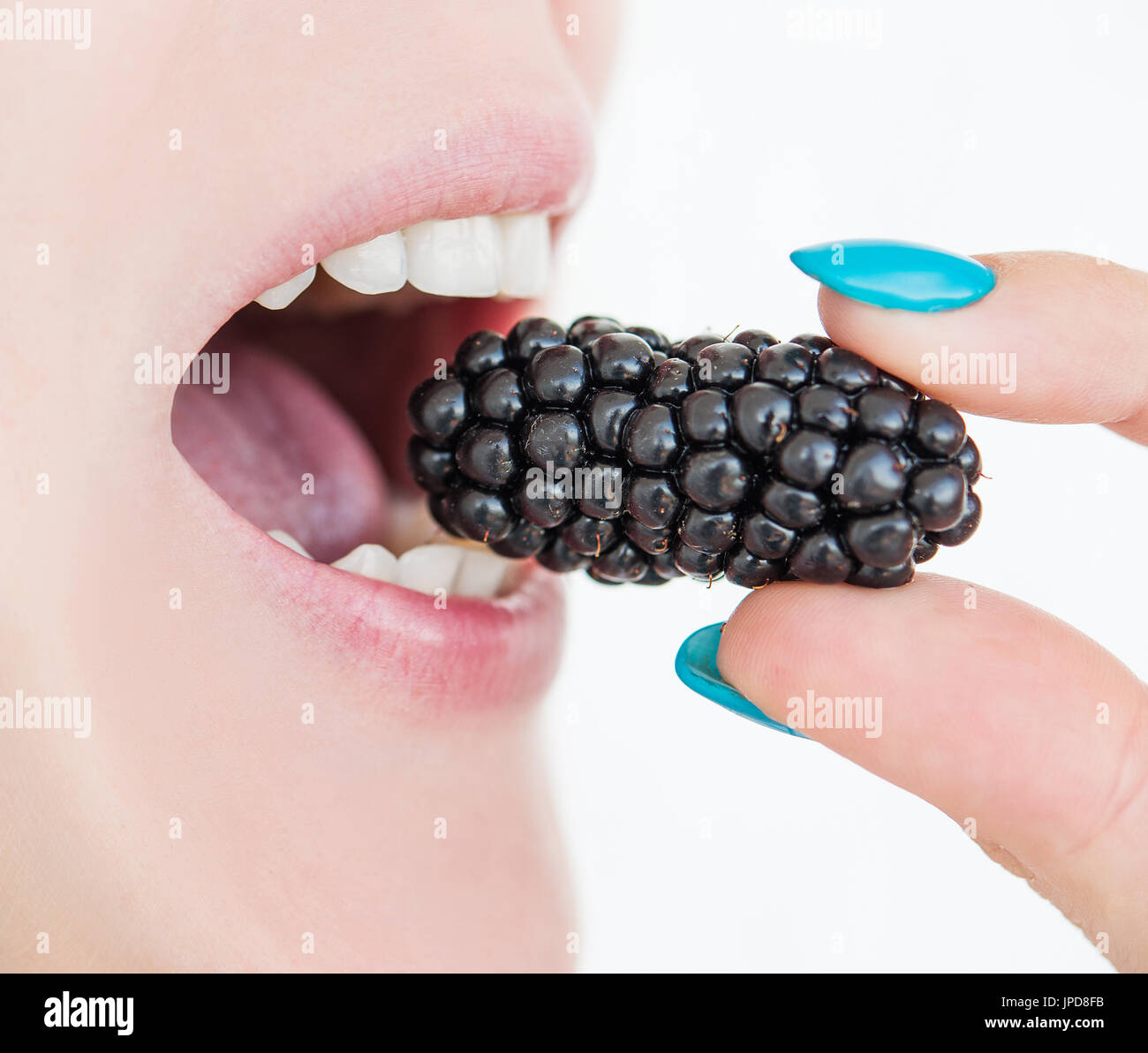 girl bites a BlackBerry Stock Photo - Alamy