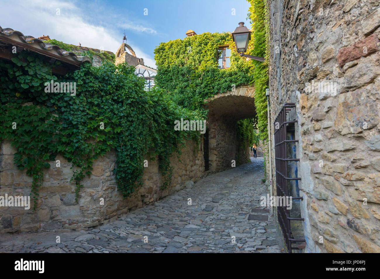 Narrow street in old medieval town of Peratallada, Spain Stock Photo ...