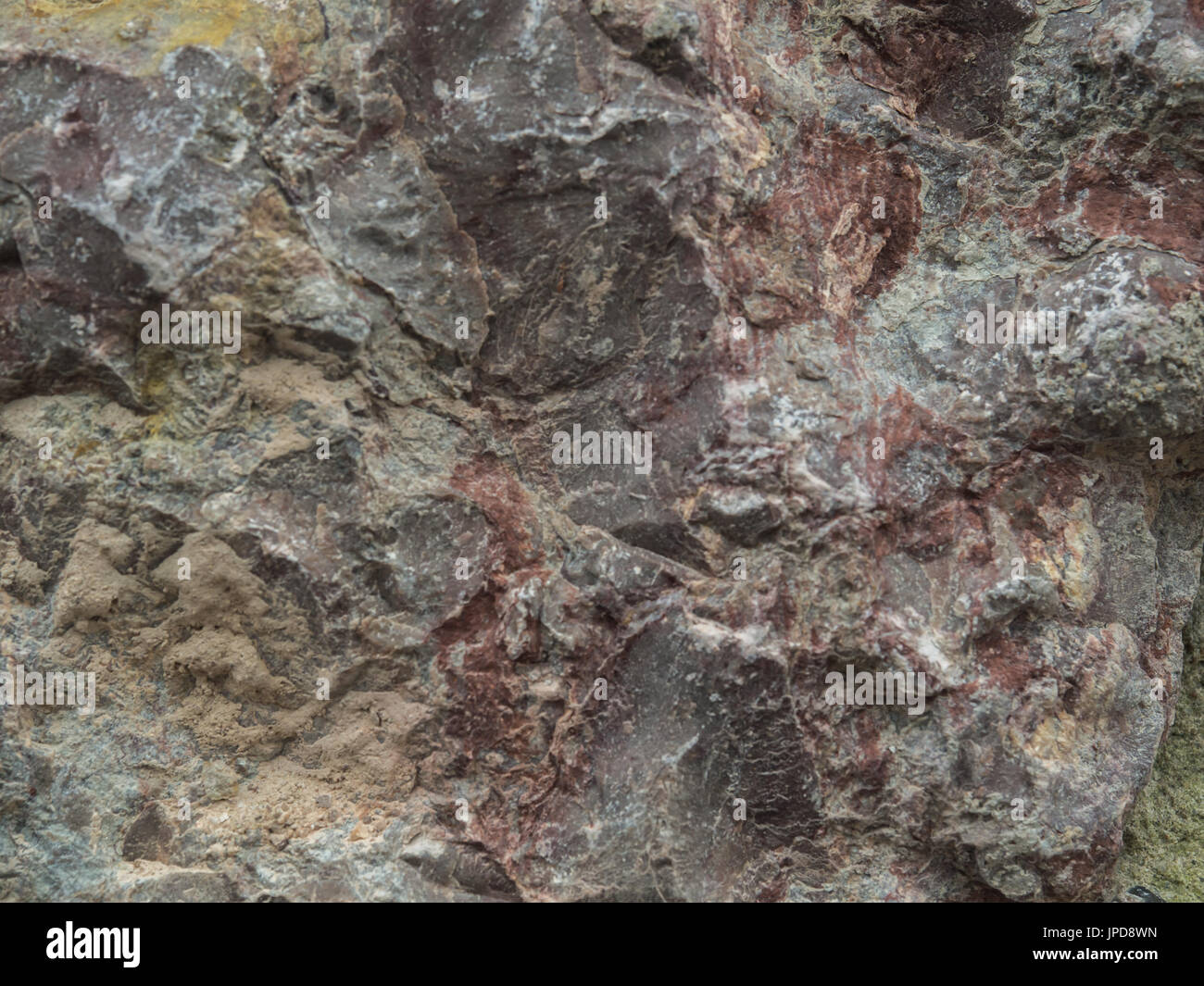 Background. The wall of multi-coloured stone Stock Photo - Alamy