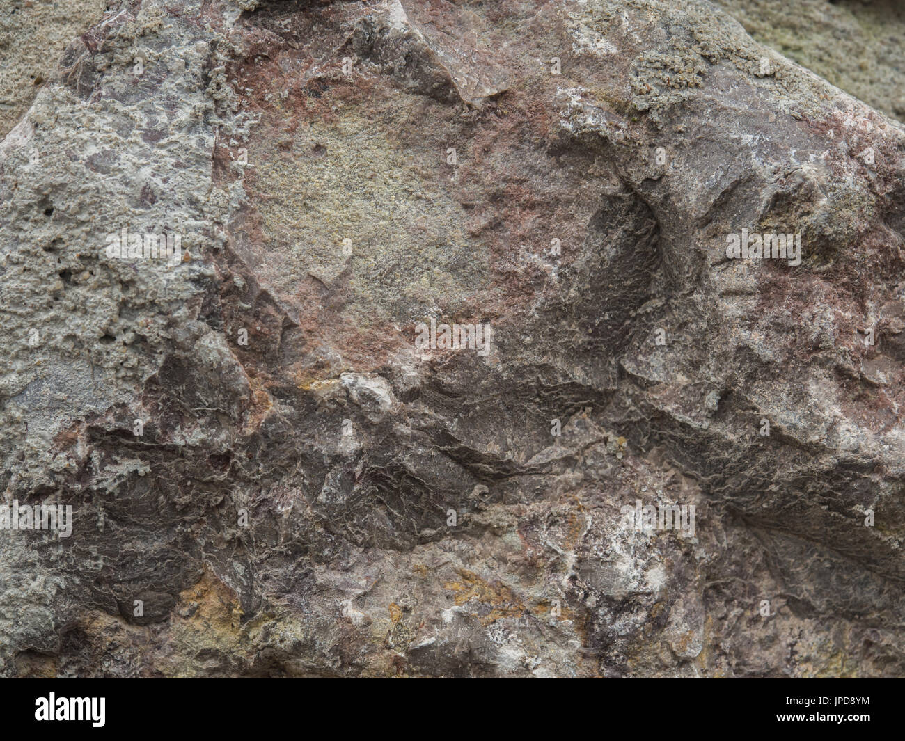 Background. The wall of multi-coloured stone Stock Photo - Alamy