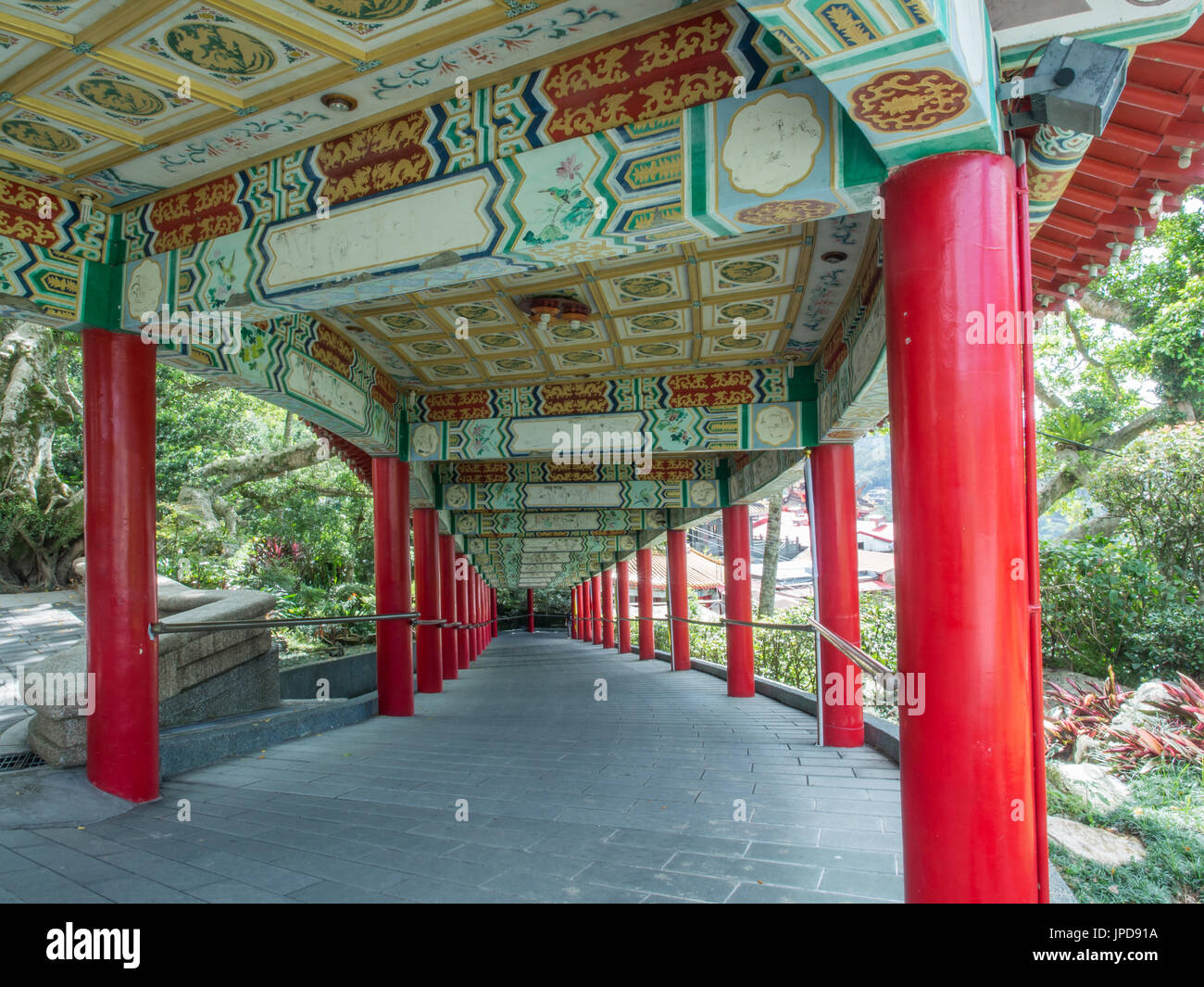 Taipei, Taiwan - October 19, 2016: Long corridor with red columns ...