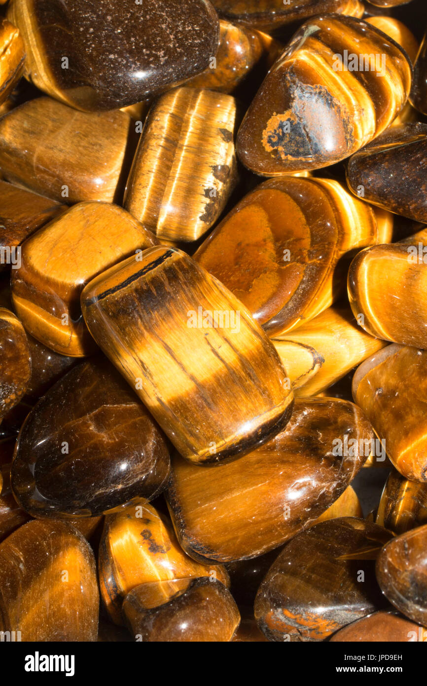 Polished tiger eye Stock Photo - Alamy