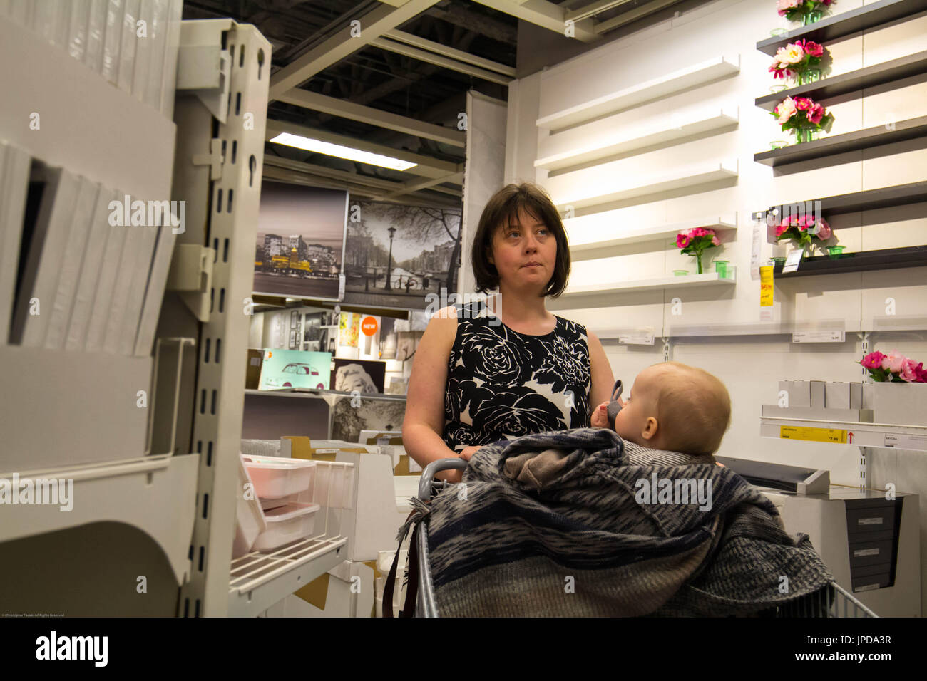 Shopping with her baby Stock Photo - Alamy