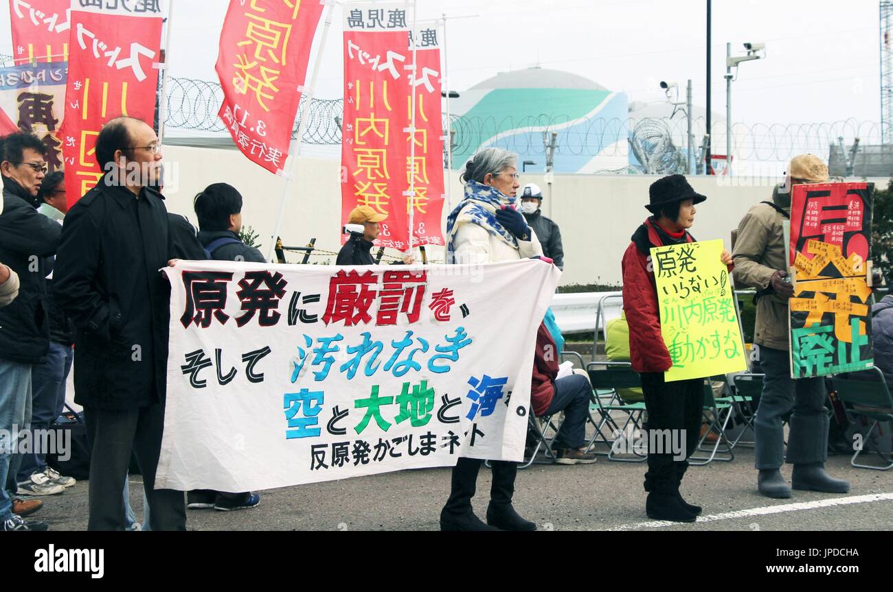 People stage a rally in front of Kyushu Electric Power Co.'s Sendai ...