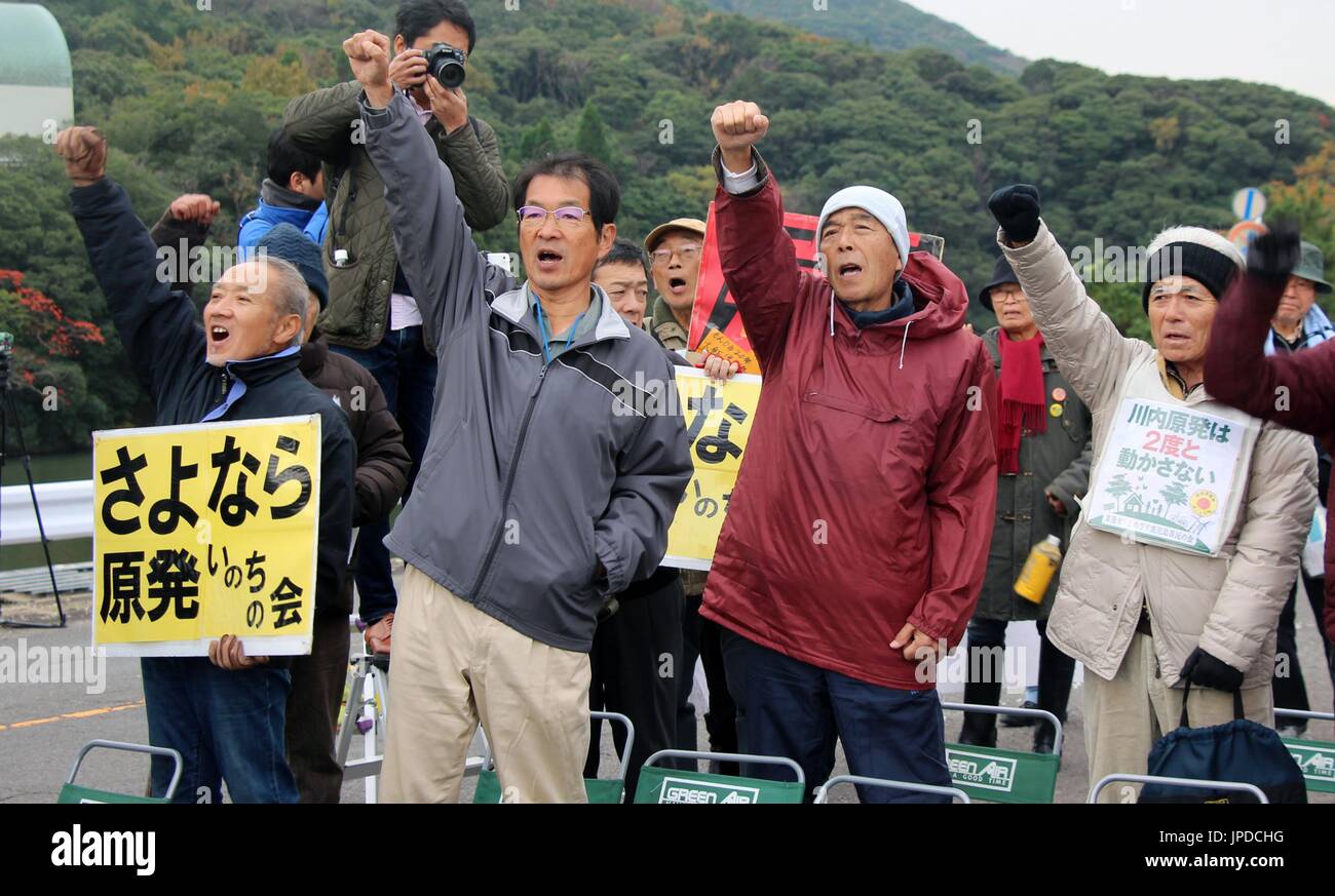 People stage a rally in front of Kyushu Electric Power Co.'s Sendai ...
