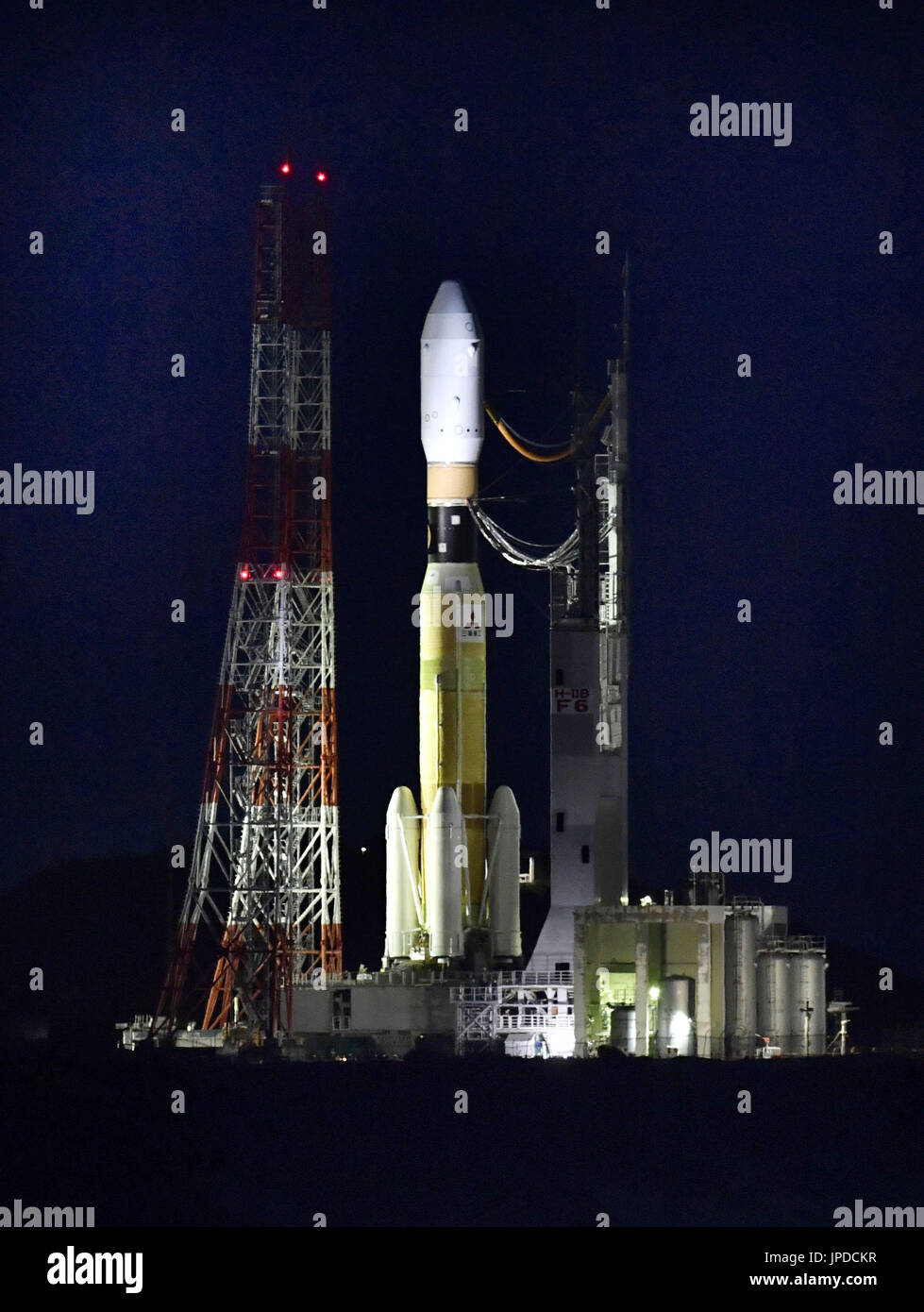 An H-2B rocket carrying the Konotori 6 unmanned cargo spacecraft is ...